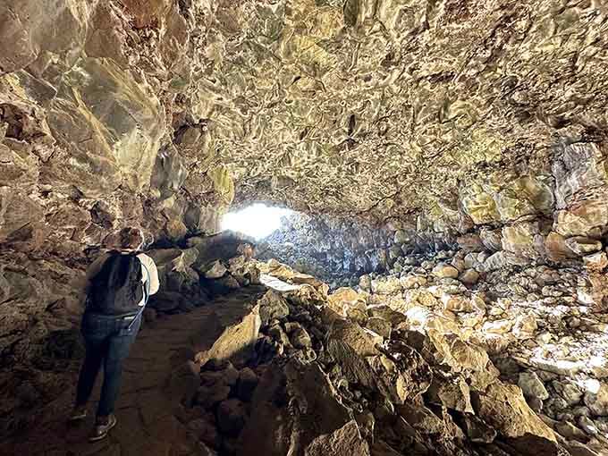 The path through this cave feels like you're walking through nature's own intricate masterpiece, illuminated just right.