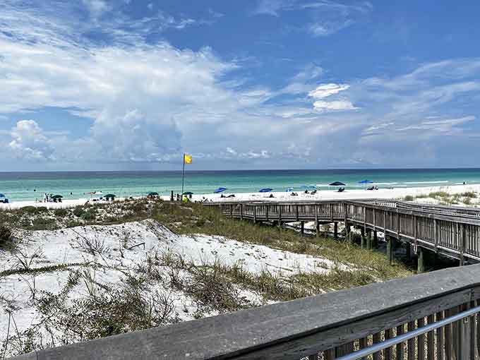 The boardwalk to paradise looks exactly like this, complete with sugar-white dunes and that impossible turquoise horizon.