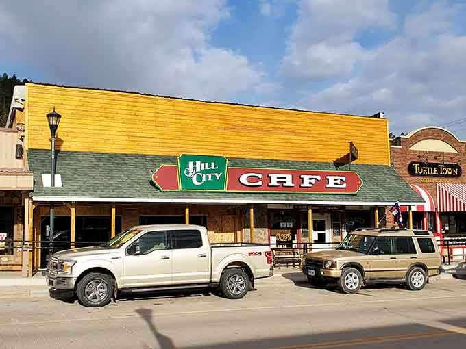 Morning sunshine bathes the bright yellow exterior of Hill City Caf&eacute;, where locals and tourists alike gather for breakfast magic in the Black Hills.