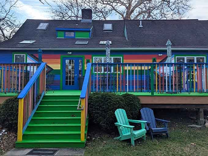That rainbow-striped deck isn't just Instagram bait; it's your signal that something wonderfully weird awaits inside.