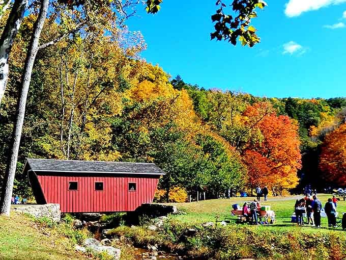 Fall foliage so vibrant it makes your screensaver jealous, with a covered bridge for maximum New England charm.