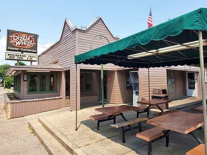 The covered curb service area where cars pull up and dreams of perfect onion rings come true.
