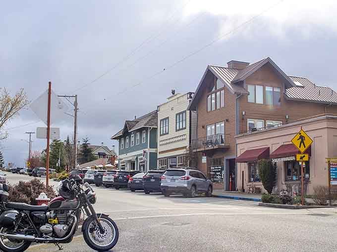 The village clusters along the bluff, buildings arranged like they're all trying to get the best view possible.