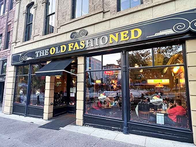 The storefront beckons like a warm Wisconsin welcome, its golden lettering promising comfort and tradition just steps from the Capitol.