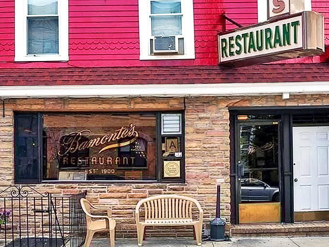 The unassuming storefront of Bamonte's Restaurant, with its classic signage and stone facade, promises authentic Italian-American tradition inside.