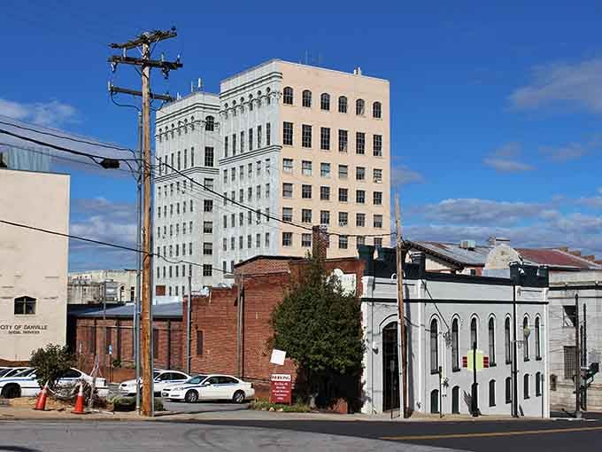 Danville's skyline features a striking white high-rise building, standing tall among historic brick structures like an architectural time capsule.