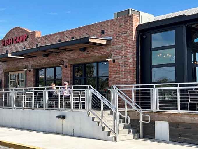 Diners enjoy the outdoor deck seating, perfect for soaking up Florida sunshine while awaiting those legendary seafood.