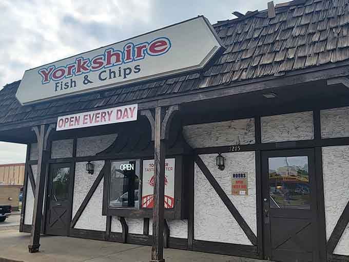 The Tudor-style facade of Yorkshire Fish & Chips stands like a British embassy on Denver soil, promising authentic flavors beneath its distinctive black-and-white timber framing.