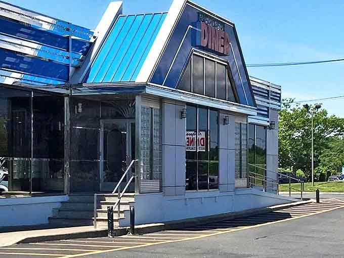The iconic blue roof of Airport Diner beckons like a beacon of breakfast hope on Veteran's Highway. Classic American architecture with a modern twist.