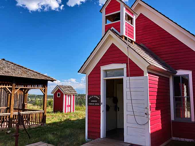 That bright red schoolhouse isn't just photogenic, it's where frontier kids learned their ABCs between mining booms and mountain winters.