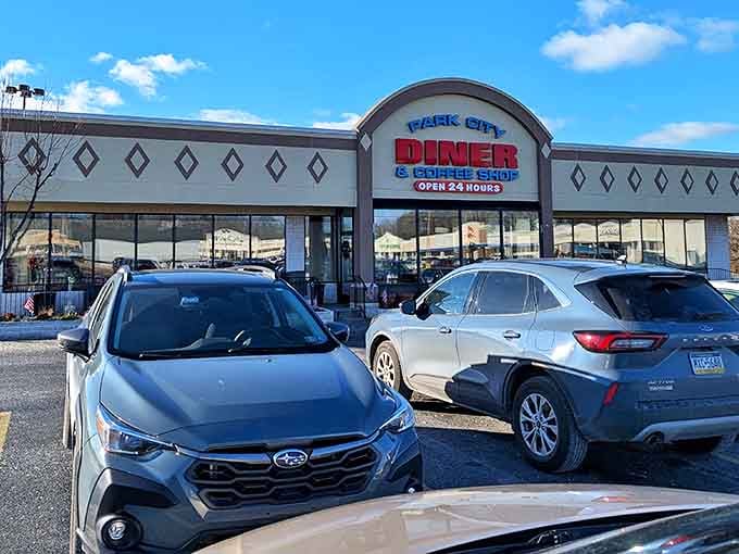 The classic diner exterior beckons like a lighthouse for hungry travelers. Open 24 hours means breakfast for dinner is always an option!