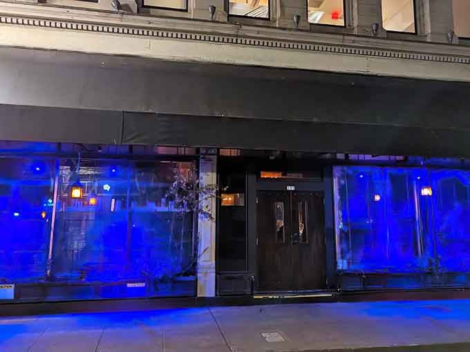 That dramatic blue lighting and dark entrance let you know immediately that this isn't your typical neighborhood sports bar experience.