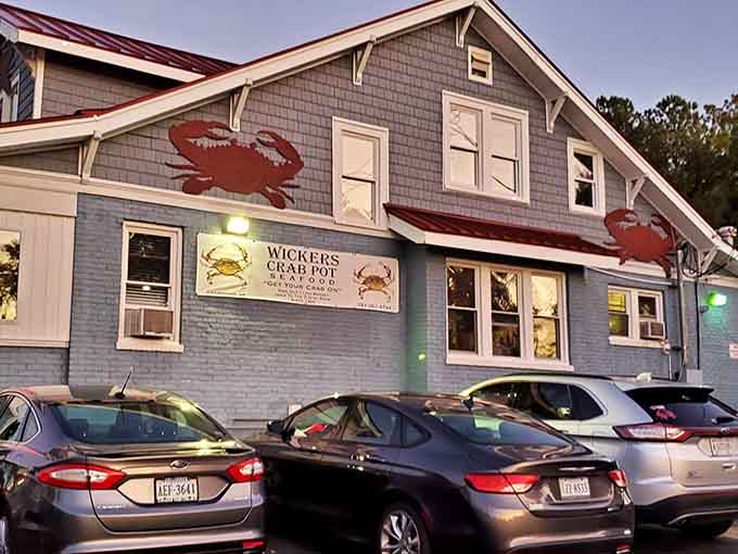 Twilight transforms Wicker's into a cozy harbor of culinary delights, where those red crabs on the exterior hint at the treasures swimming in butter inside.
