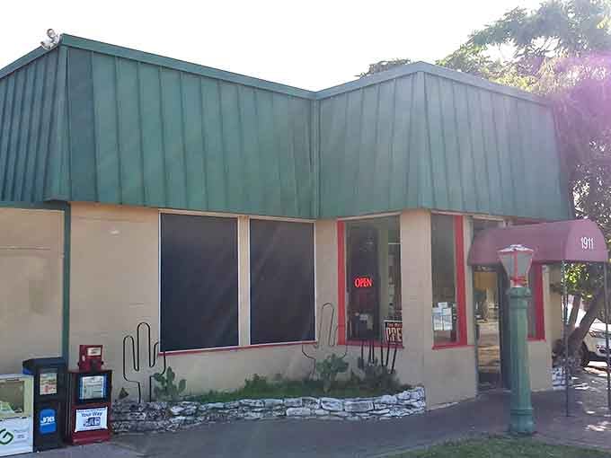 The unassuming green-roofed exterior of Enchiladas Y Mas stands as a beacon of hope for authentic Tex-Mex seekers amid Austin's sea of pretenders.