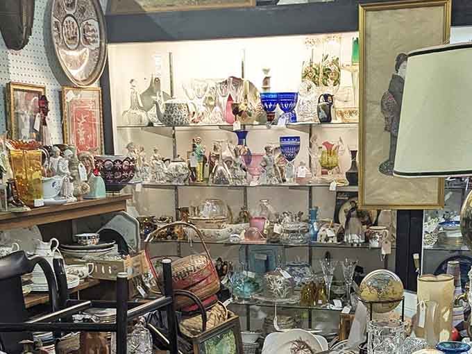 Shelves packed with porcelain figurines, glassware, and vintage treasures &ndash; like walking into your grandmother's attic if she collected everything beautiful since 1920.