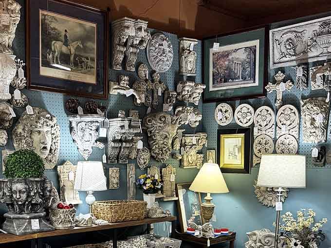 This wall of architectural salvage faces would make even the most stoic decorator break into spontaneous interior design poetry.