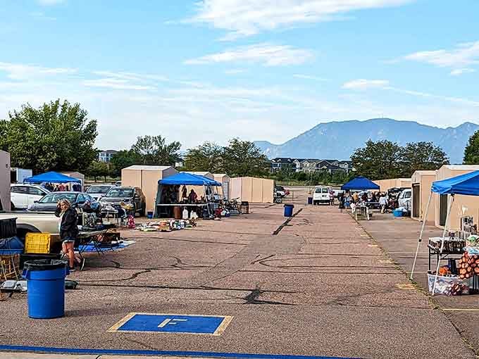 Mountains frame your shopping adventure, where blue-topped stalls hold secrets waiting to be discovered by savvy bargain hunters.