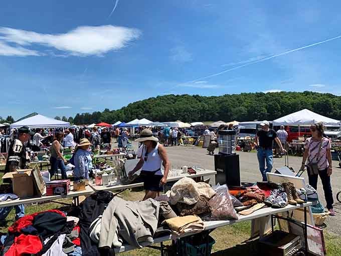 White tents stretching toward the horizon under blue skies, where treasure hunters gather for the ultimate shopping adventure.