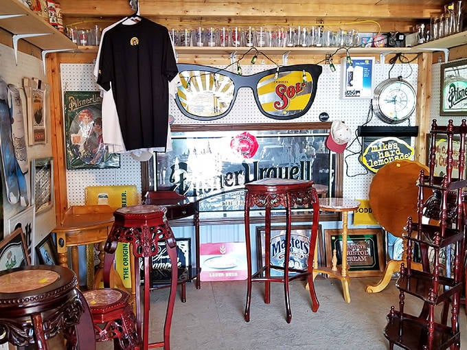 Vintage advertising signs and bar stools create a nostalgic wonderland. One person's garage cleanup is another's living room centerpiece!