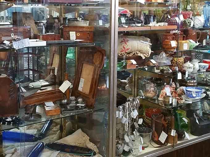 Vintage clothing racks offering floral patterns and classic cuts that fast fashion keeps trying to replicate but never quite gets right.