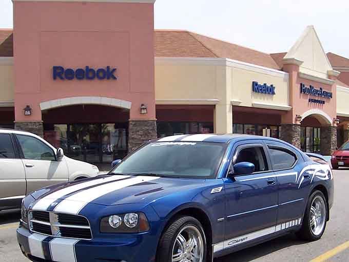 Reebok's outlet storefront welcomes shoppers with promises of athletic gear that won't require athletic-level budgets to afford.