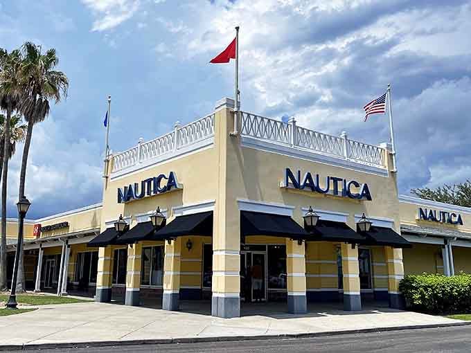 Nautica's corner storefront gleams in the Gulf Coast sunshine, promising nautical style at landlubber prices. Those white railings aren't just decorative&mdash;they're holding back waves of savings.