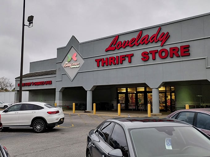 The iconic red Lovelady sign beckons bargain hunters like a retail lighthouse guiding ships to treasure-filled shores.