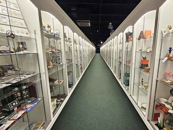 The collector's dream corridor! Glass display cases stretch into infinity, each one a miniature museum of treasures waiting to be discovered.
