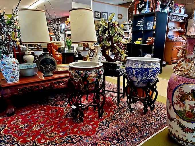 Elegant porcelain planters and vintage lamps create a sophisticated display atop a rich oriental rug &ndash; timeless treasures for discerning collectors.