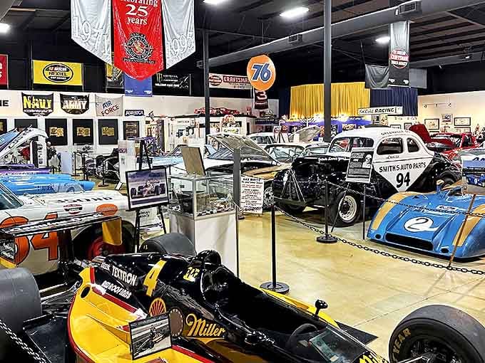 The museum floor gleams almost as brightly as the polished race cars themselves, a colorful congregation of speed demons waiting to tell their stories.