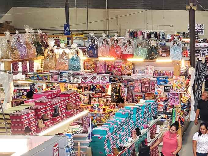 Princess dresses and candy displays tower overhead while shoppers hunt for treasures in this wonderland of possibilities.