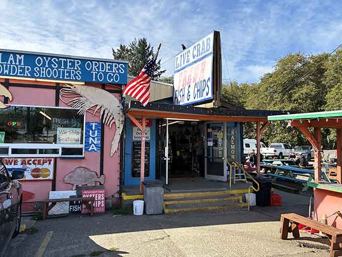 Stars and stripes flutter above picnic tables where locals gather, proving patriotism and great fish go hand in hand.