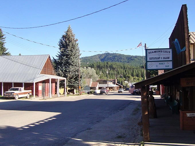 Diamond Lil's sign stands as a promise of frontier hospitality, where steaks and stories are served with equal generosity against mountain backdrops.