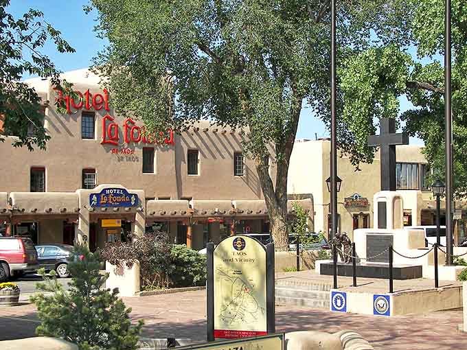 The historic Hotel La Fonda de Taos stands proudly on the plaza, its adobe walls whispering stories of travelers who came for a night and stayed for decades.
