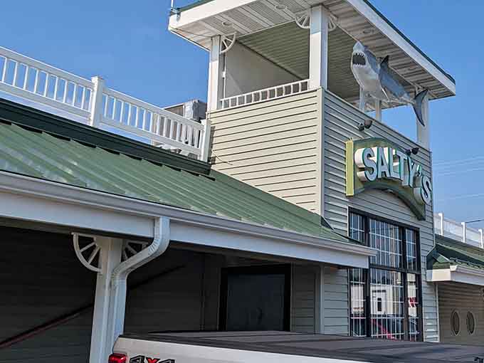 The iconic shark silhouette guards Salty's entrance like a maritime sentinel, welcoming hungry travelers to this landlocked seafood oasis in Fond du Lac.