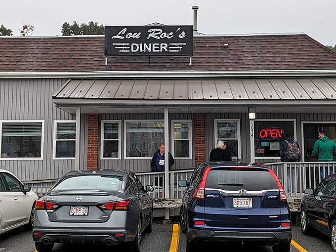 The unassuming exterior of Lou Roc's Diner stands like a breakfast beacon in Worcester, promising morning salvation to the hungry masses.