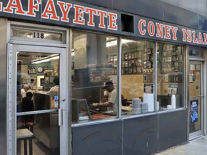Large windows invite passersby to witness culinary history being made one perfectly assembled coney dog at a time.