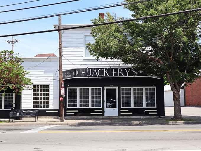 That classic black awning and white clapboard exterior practically whispers "Louisville institution" without saying a word at all.