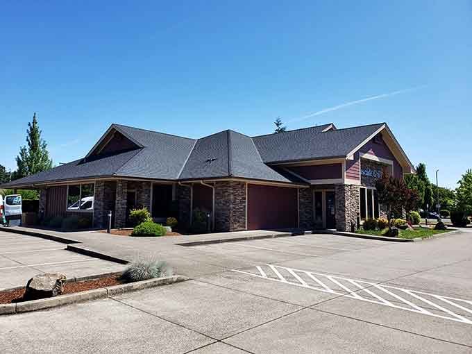 Under clear blue Oregon skies, Cascade Grill's lodge-like exterior stands ready to welcome hungry travelers from across the state.