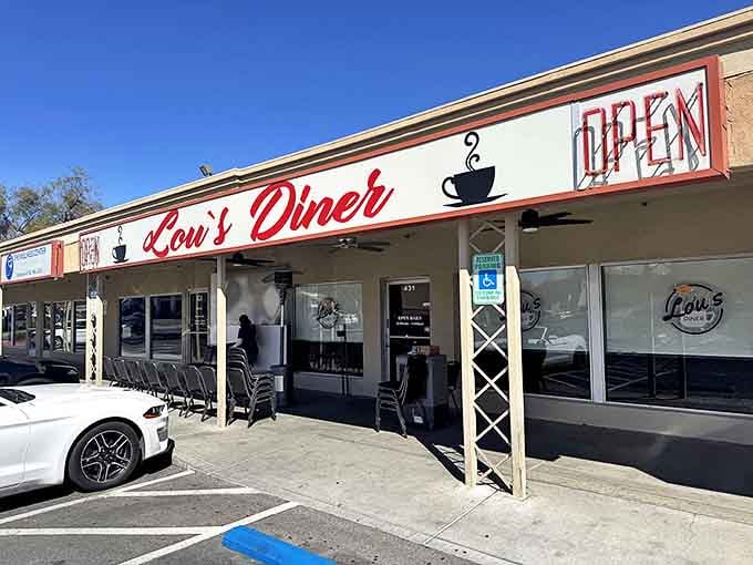 Morning sunshine illuminates Lou's welcoming facade, where the neon "OPEN" sign might as well read "Come in, we've been expecting you."