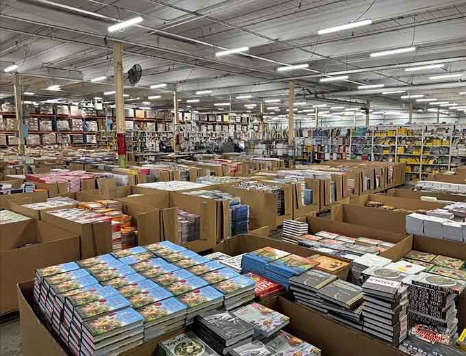 Rows of bargain books stretch endlessly at Book Warehouse Outlet, a paradise for readers hunting hidden literary treasures.