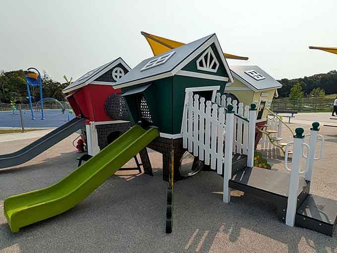 That whimsical playhouse village looks like Dr. Seuss designed a neighborhood after drinking too much coffee.