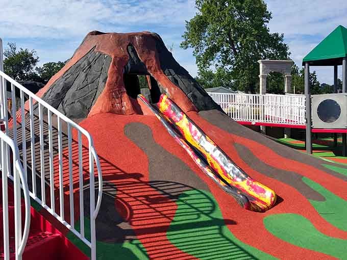 The volcano centerpiece rises like a colorful monument to childhood adventure, complete with slides that'll make kids feel like lava-surfing heroes.