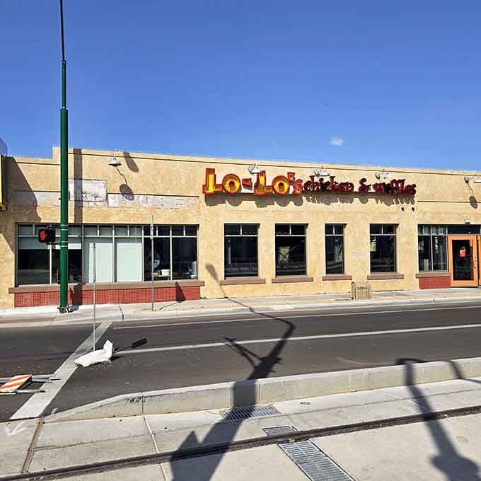 That colorful sign isn't just advertising chicken and waffles; it's basically a beacon of hope for hungry souls everywhere.