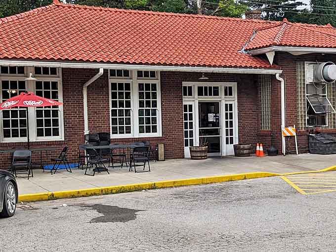 The iconic red-tiled roof of Wabash BBQ stands out like a beacon of hope for hungry travelers. This former railroad depot now signals the arrival of smoky deliciousness.