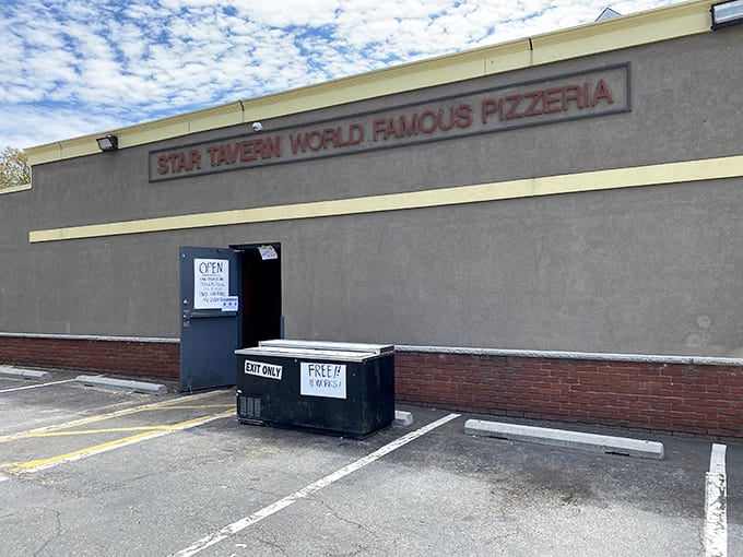 That "World Famous Pizzeria" sign isn't bragging, it's just stating facts under a dramatic New Jersey sky.