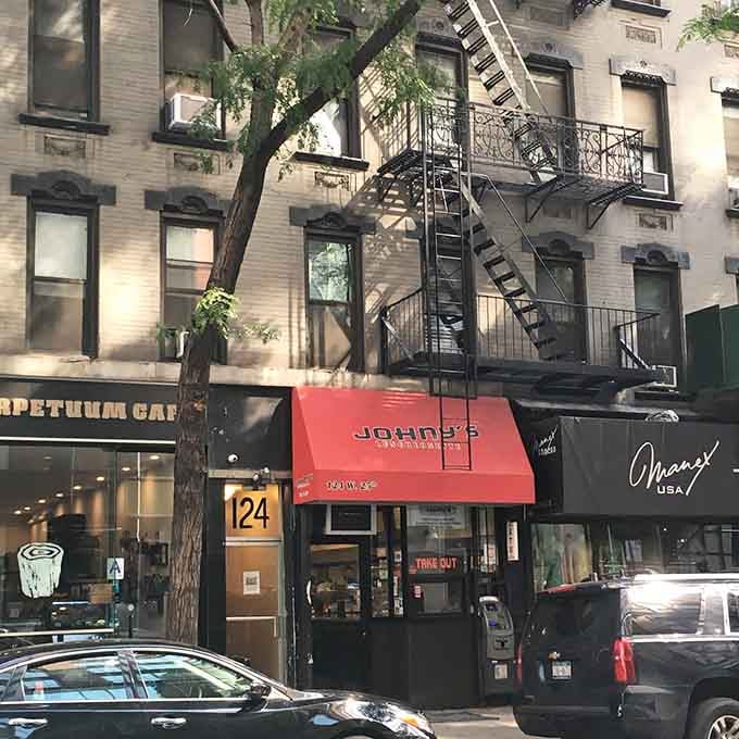 That red awning is your beacon to breakfast bliss in the heart of Greenwich Village.
