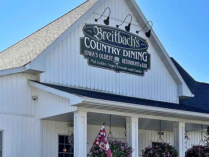 The pristine white exterior of Breitbach's stands like a beacon of hope for hungry travelers. Iowa's oldest restaurant promises comfort before you even step inside.