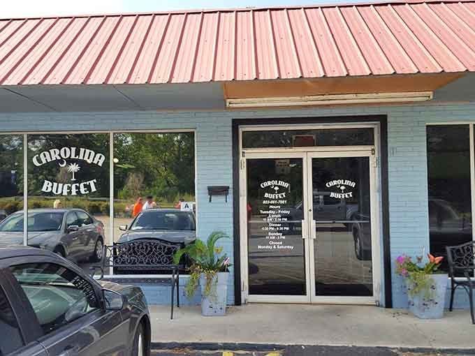 That cheerful blue exterior with the red roof is your beacon to buffet bliss in West Columbia.