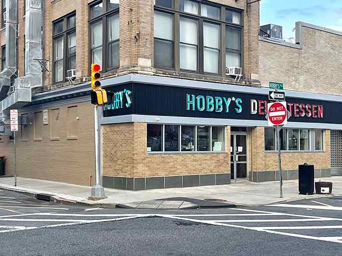 That corner storefront with the neon sign has been calling hungry folks home since the Kennedy era.